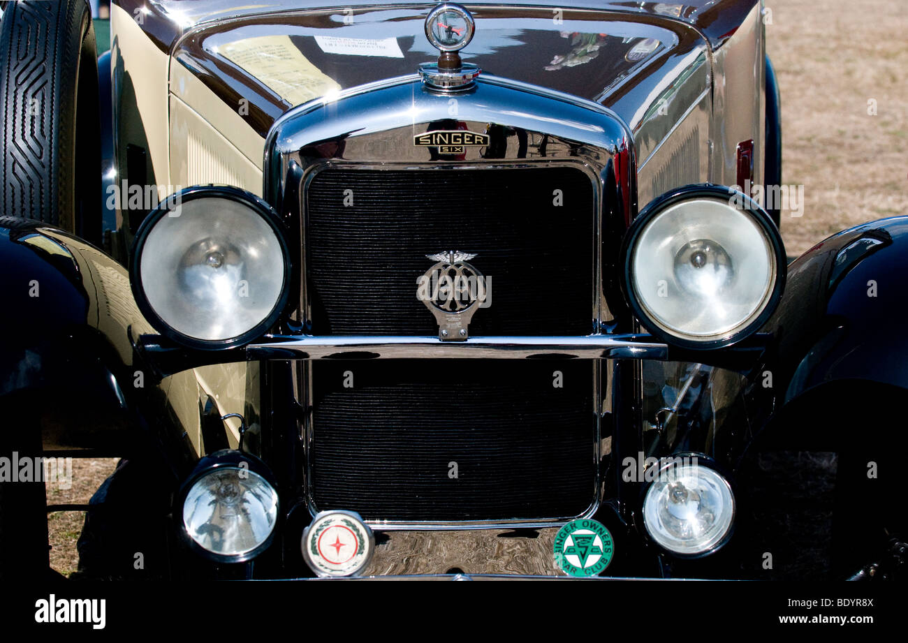 The headlights and radiator grill of a Singer Six classic car on ...
