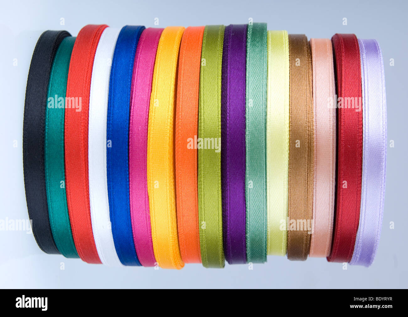 a stack of various colours of ribbon Stock Photo - Alamy