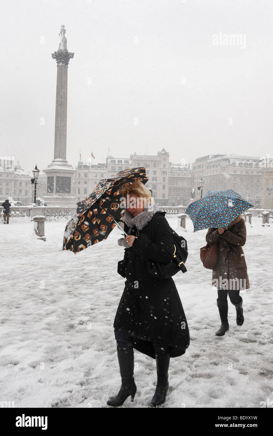 Woman walking work in snow hi-res stock photography and images - Alamy
