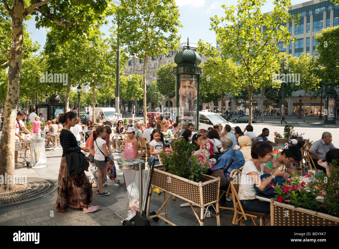 People eating at an outside cafe, The Champs Elysee, Paris, France ...