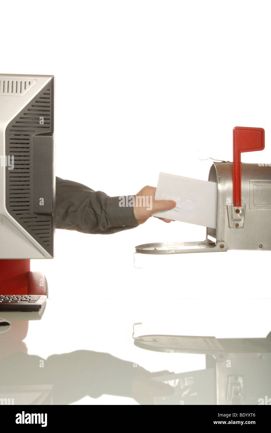 Business man behind a monitor taking a letter from a U.S. mailbox, a ...