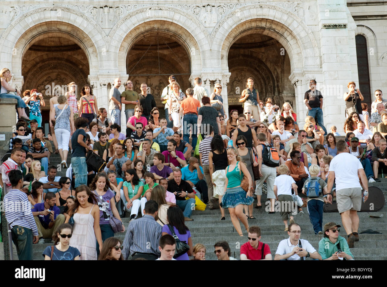 People enjoying the entertainment on the steps of the Sacre Coeur ...