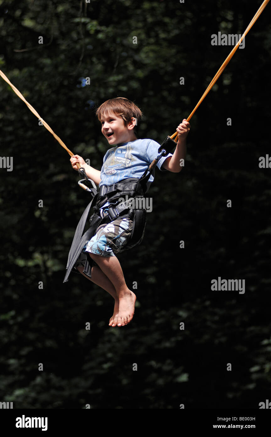 Little boy jumping on the trampoline in the Nuremberg Zoo, Nuremberg ...
