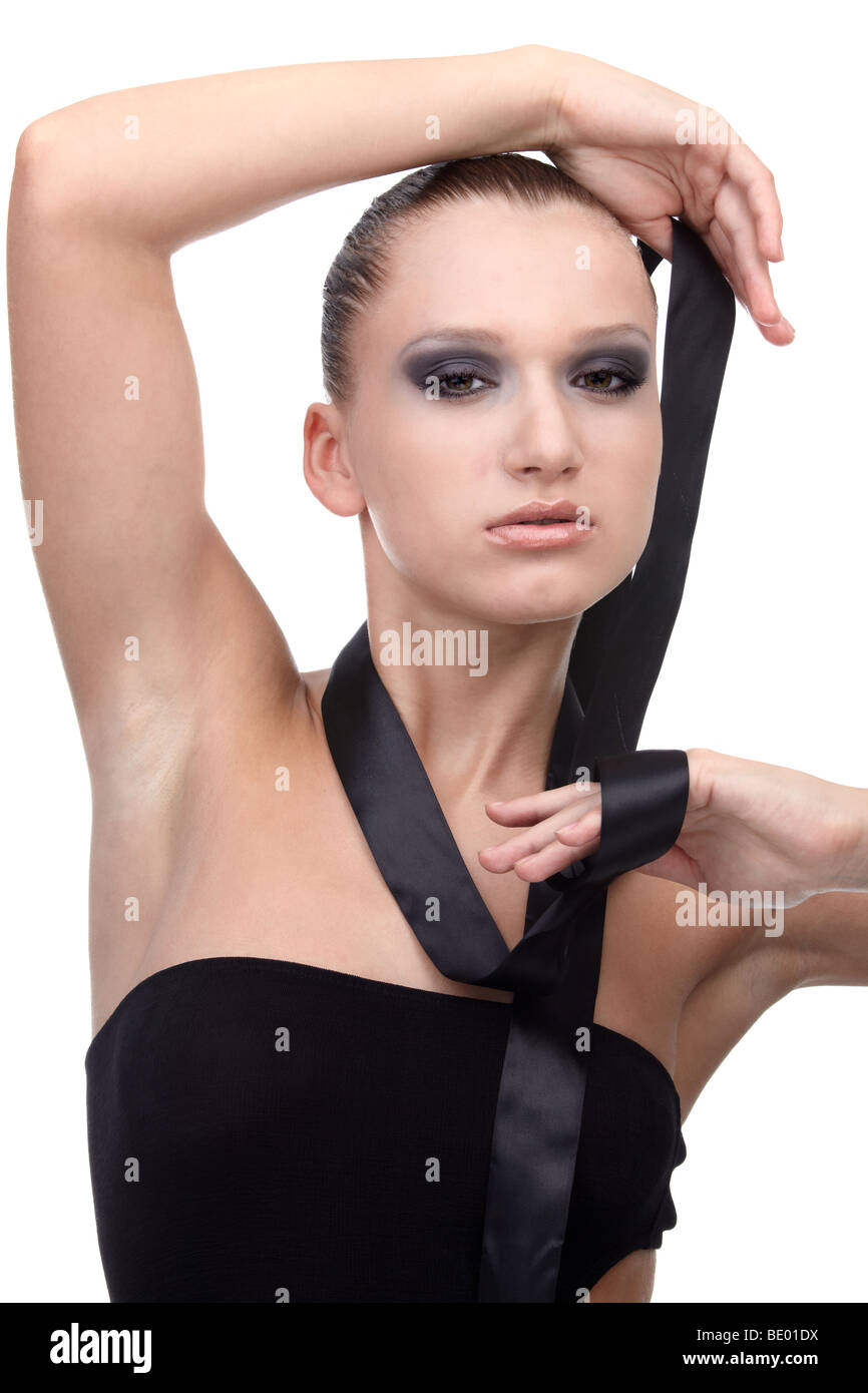 portrait of beautiful dark haired model posing with black cloth riband ...