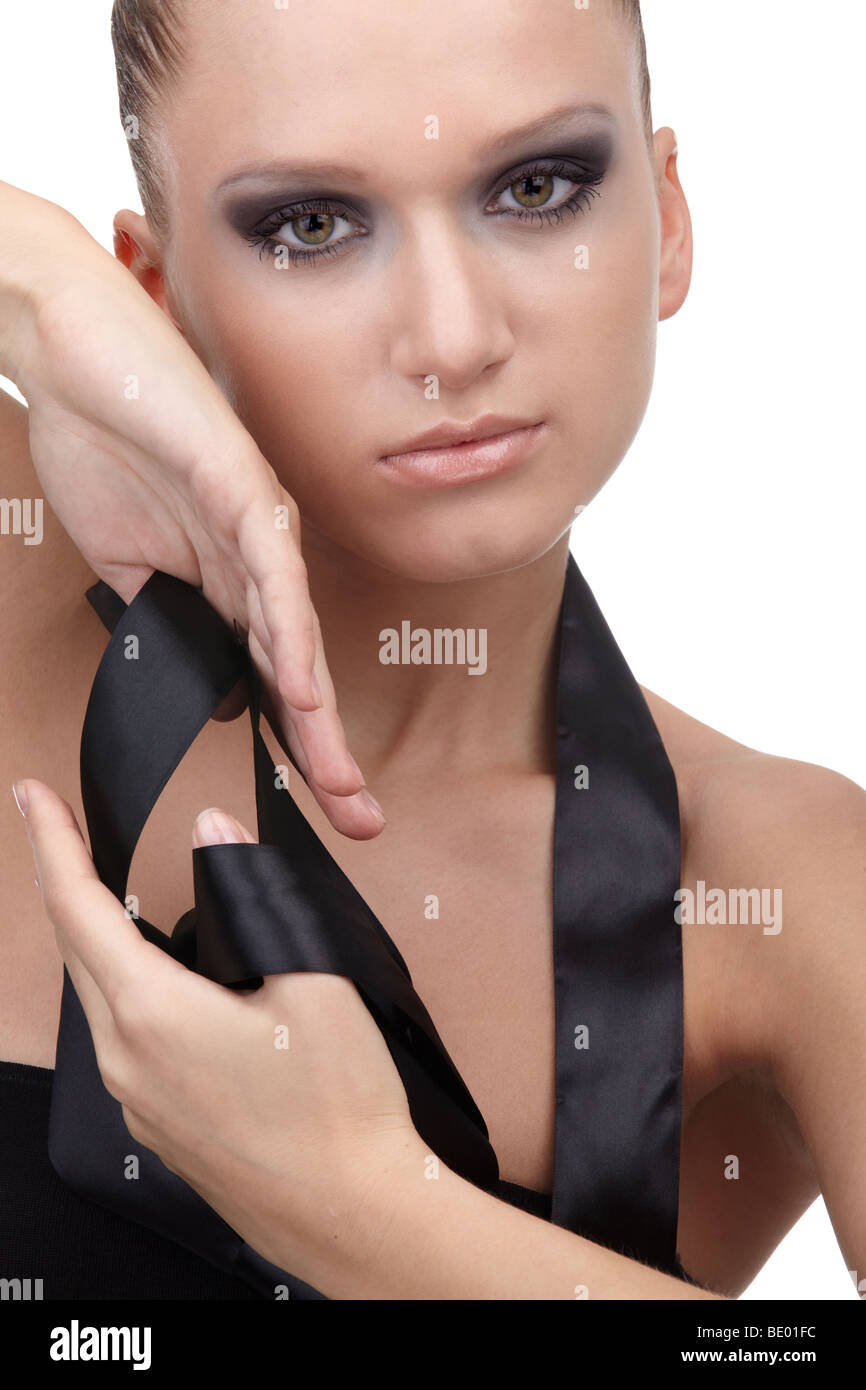 portrait of beautiful dark haired model posing with black cloth riband ...