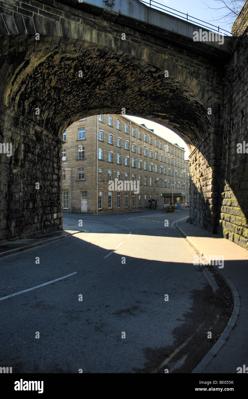 Railway arch with chocolate factory in background Stock Photo - Alamy