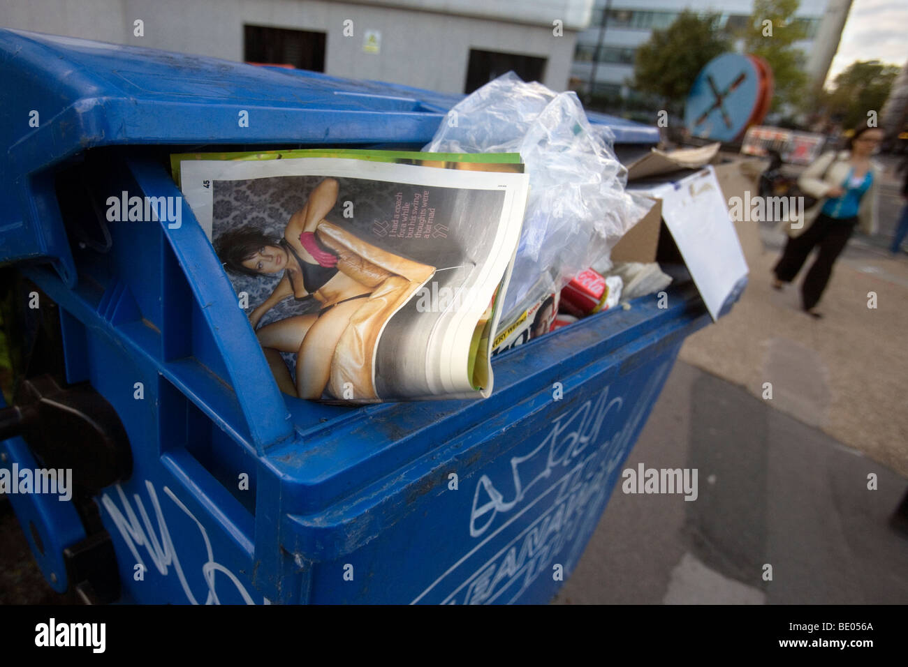 a magazine showing a picture of a lapdancer in a rubbish bin in ...