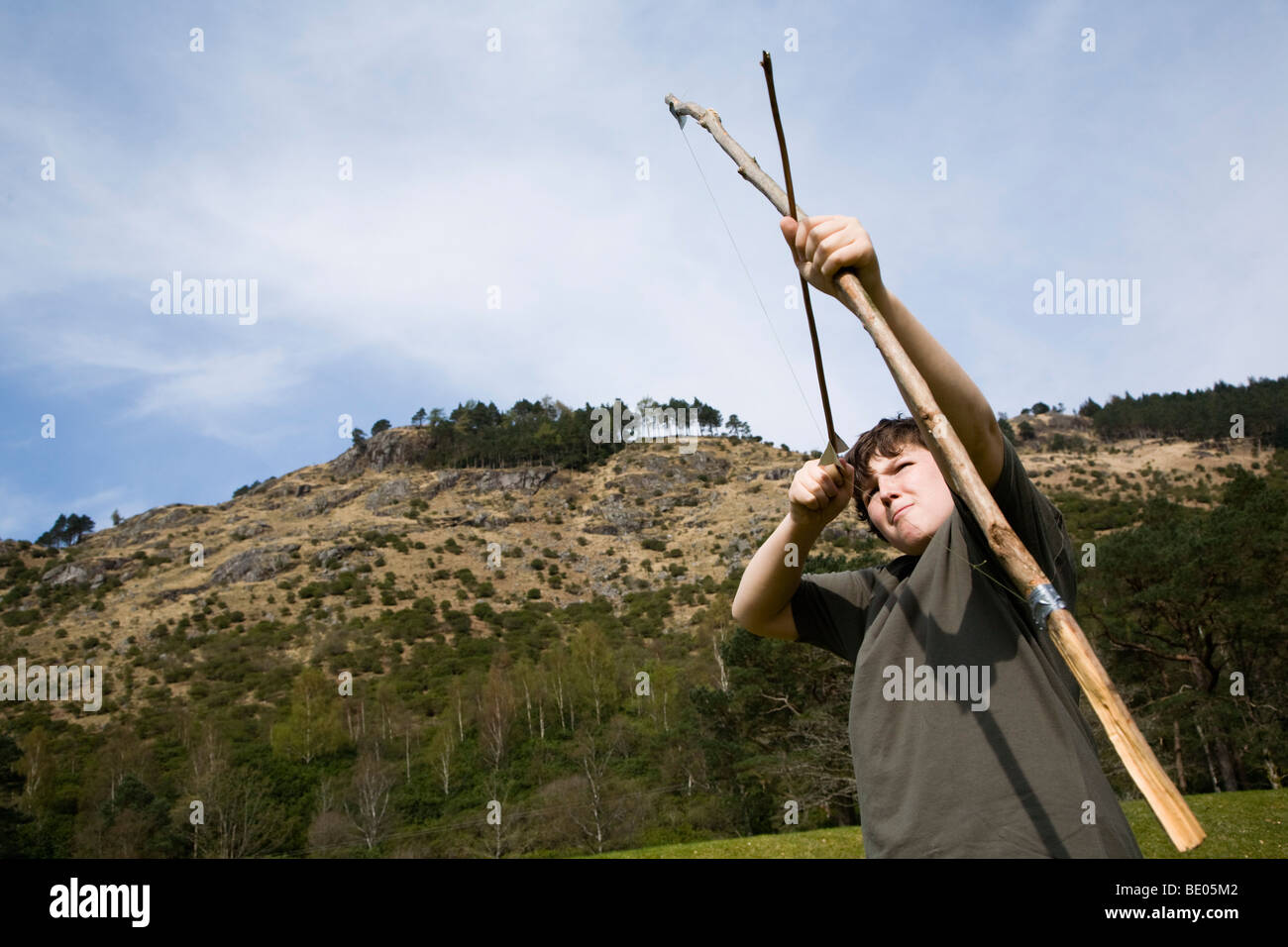 Boy with bow & arrow Stock Photo - Alamy