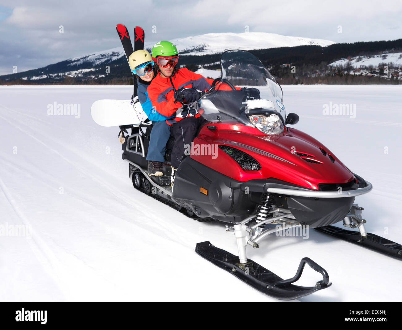 Snowmobiling couple hi-res stock photography and images - Alamy