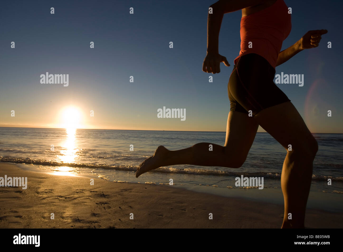 Running on beach night hi-res stock photography and images - Alamy