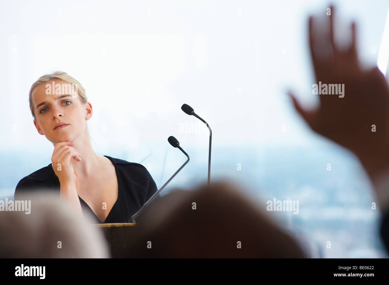 Woman answering questions Stock Photo - Alamy