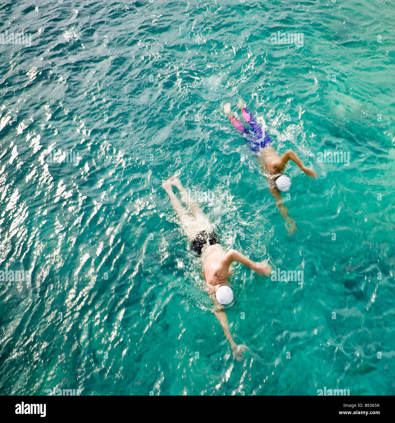 Men swimming in sea Stock Photo - Alamy