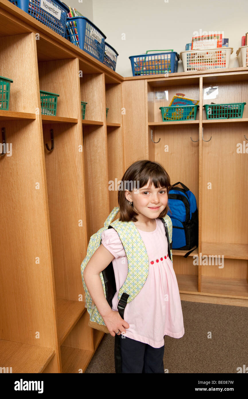 Student with back back at locker Stock Photo - Alamy