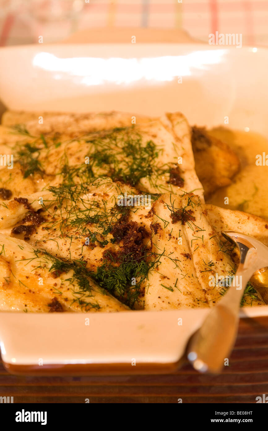 Finnish home cooking. Freshly caught pike is baked with herbs and ...