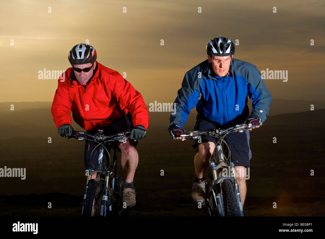 Two mountain bikers riding together Stock Photo - Alamy