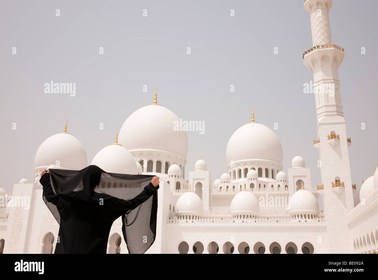 Covered woman looking at Sheik Zayed Bin Sultan Al Nahyan mosque, Abu ...