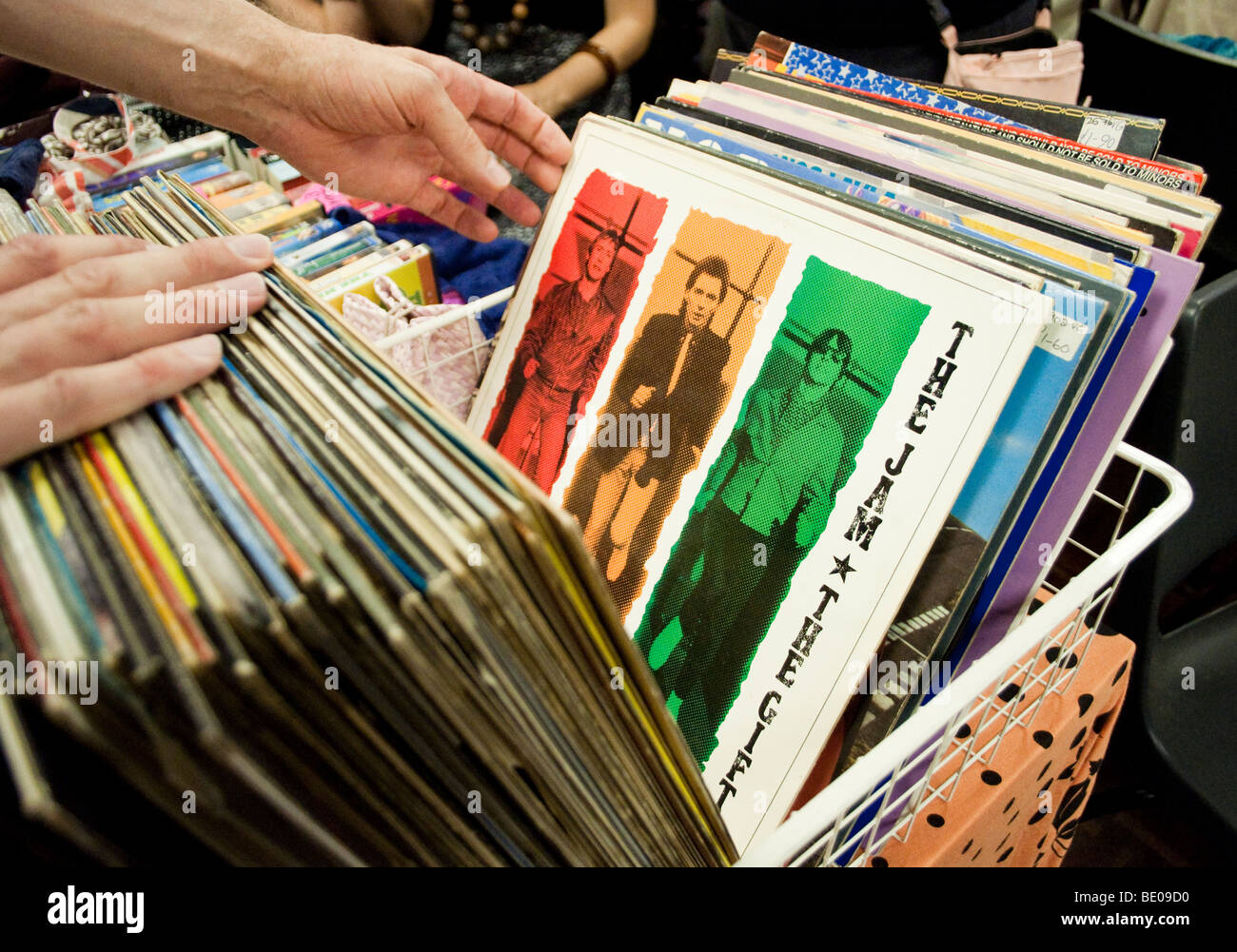 Man looking through records in Britain Stock Photo - Alamy