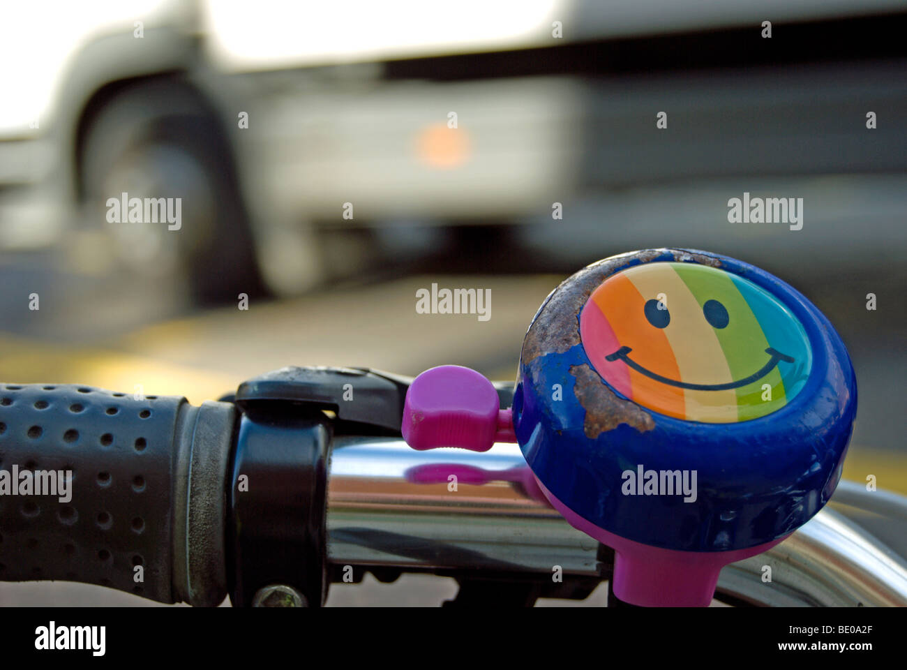 smiley face bike bell on bicycle handlebars Stock Photo - Alamy