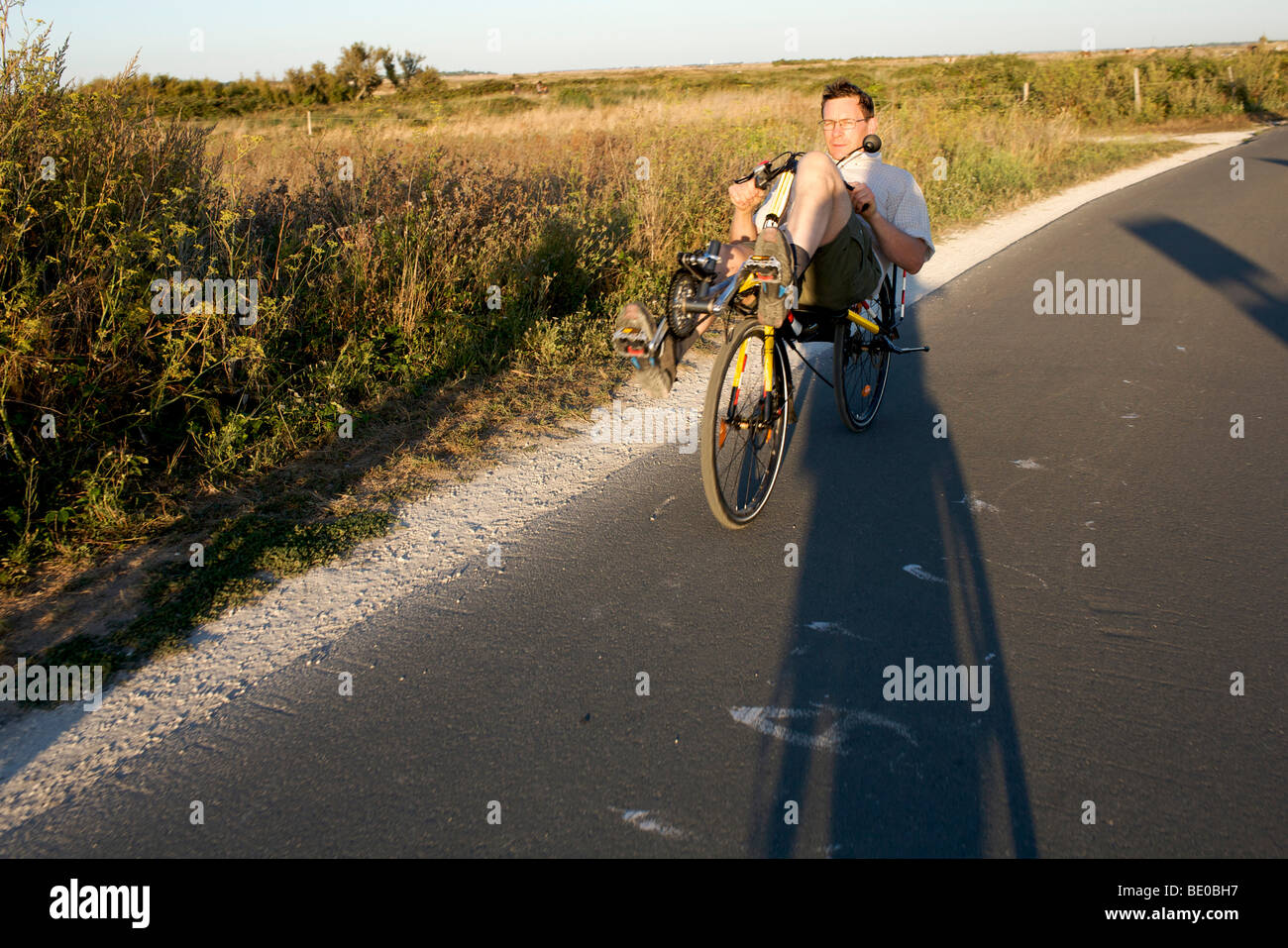 Cyclists using the Ile de Re cyclepaths Stock Photo - Alamy