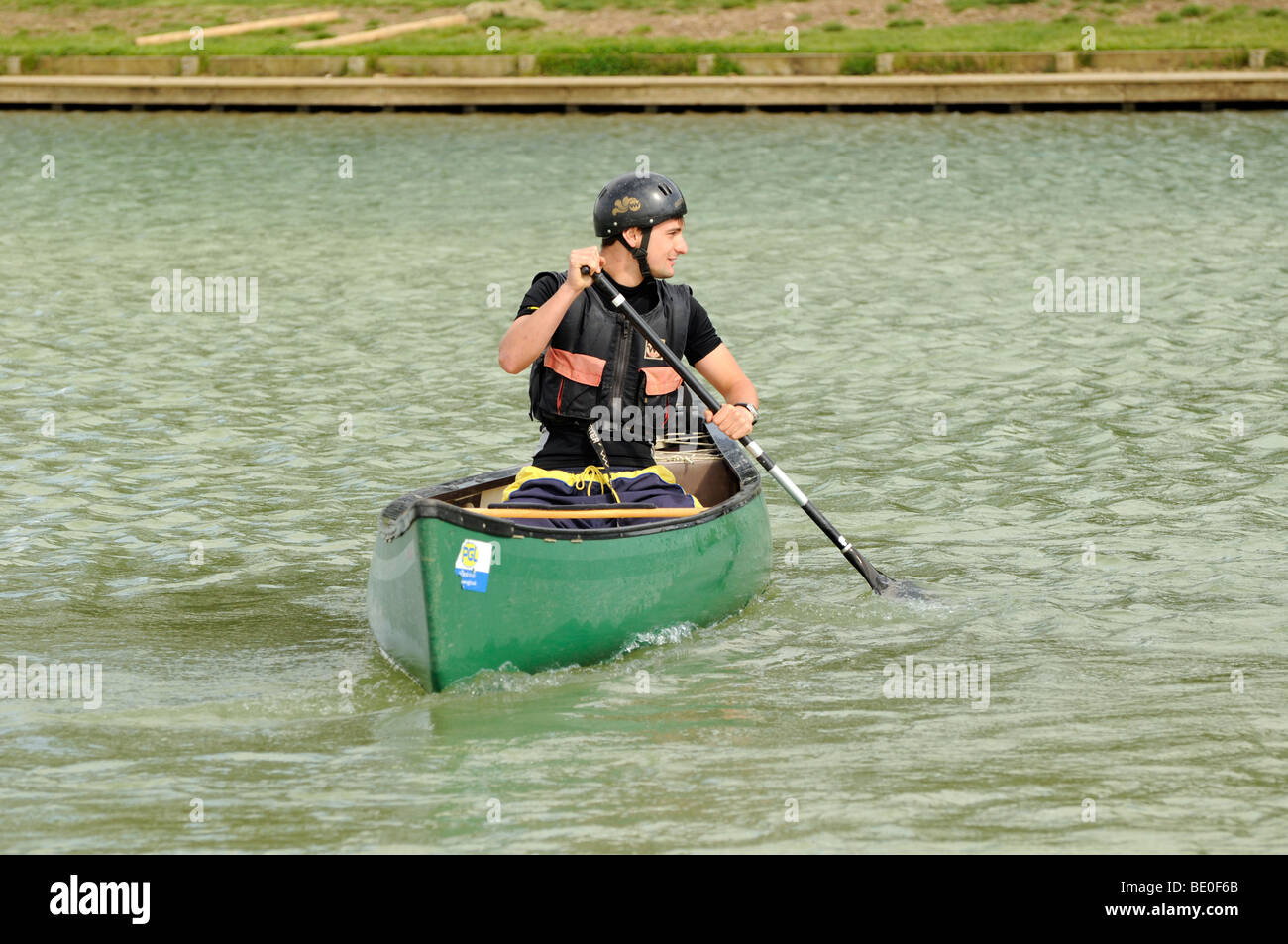 PGL camp instructor in green canoe Stock Photo - Alamy