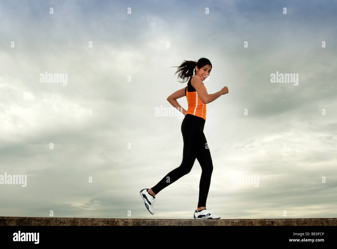 ethnic woman running Stock Photo - Alamy