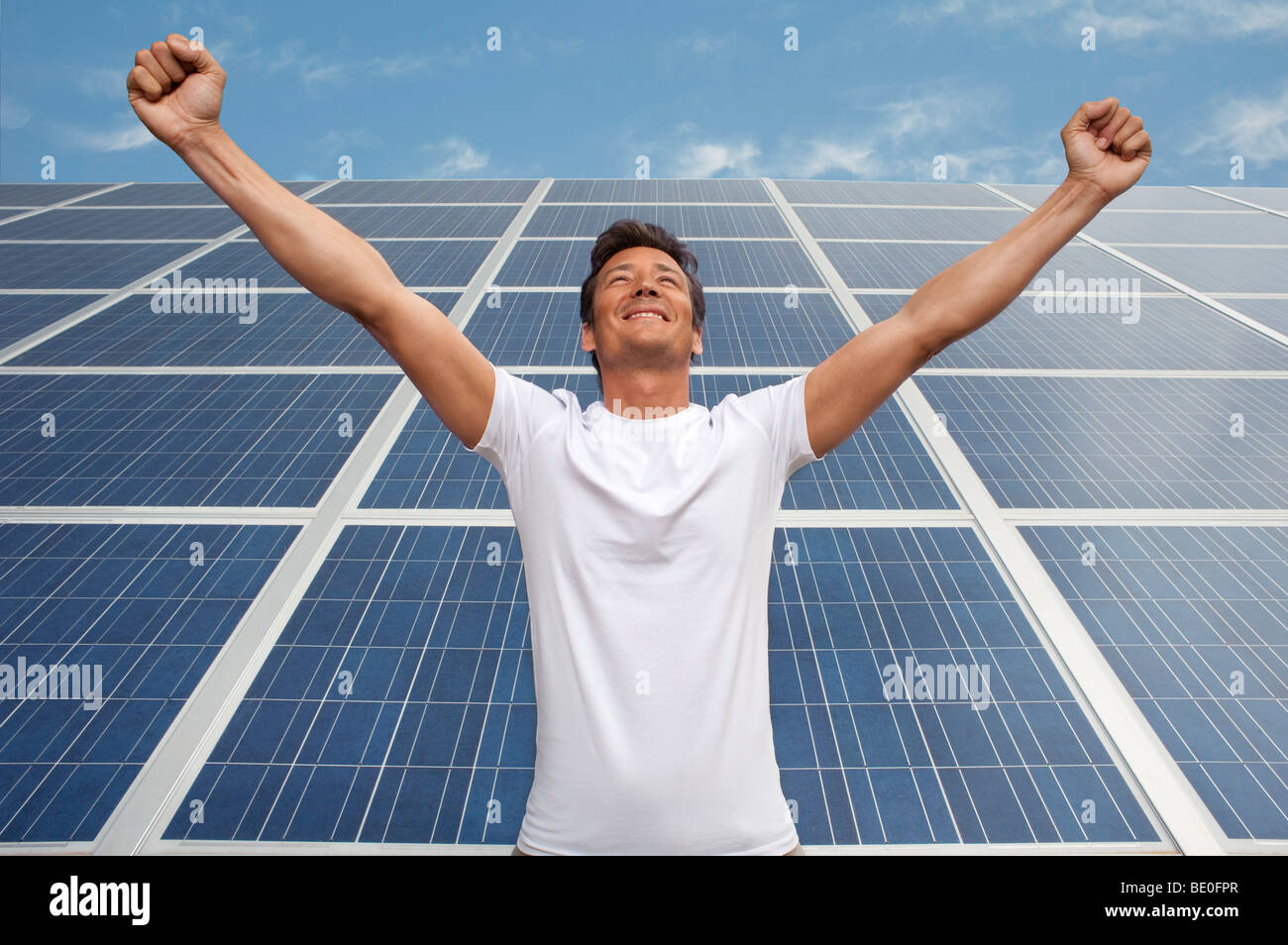 Man standing in front of solar panel Stock Photo - Alamy