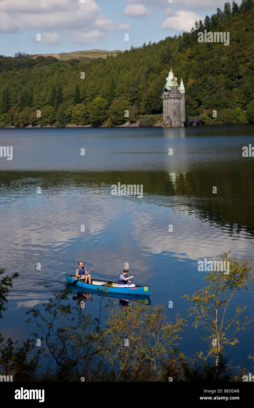 Trees and the Victorian Straining Tower reflecting in the waters of ...