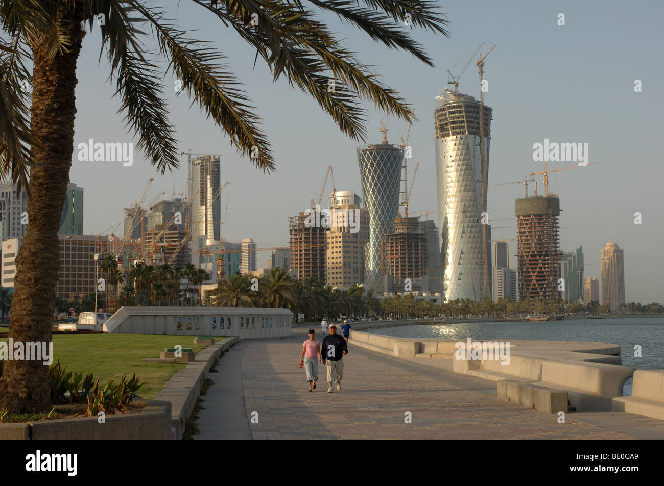 Couple Walking, The Corniche, Doha, Qatar Stock Photo - Alamy