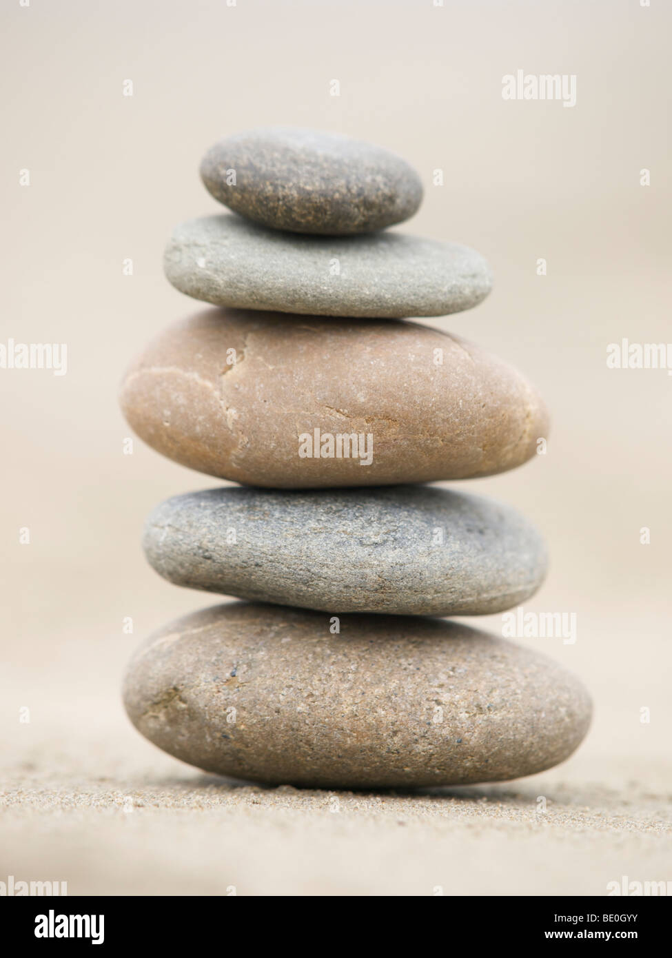 Tower of round stones pebbles stacked in balance Stock Photo - Alamy