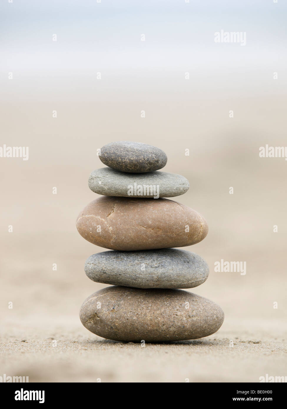 Tower of round stones pebbles stacked in balance Stock Photo - Alamy