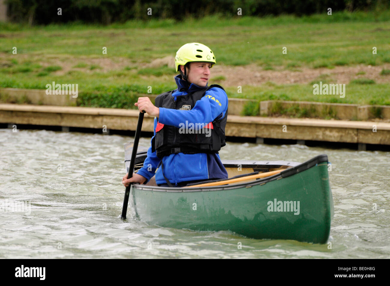 PGL camp instructor in green canoe Stock Photo - Alamy