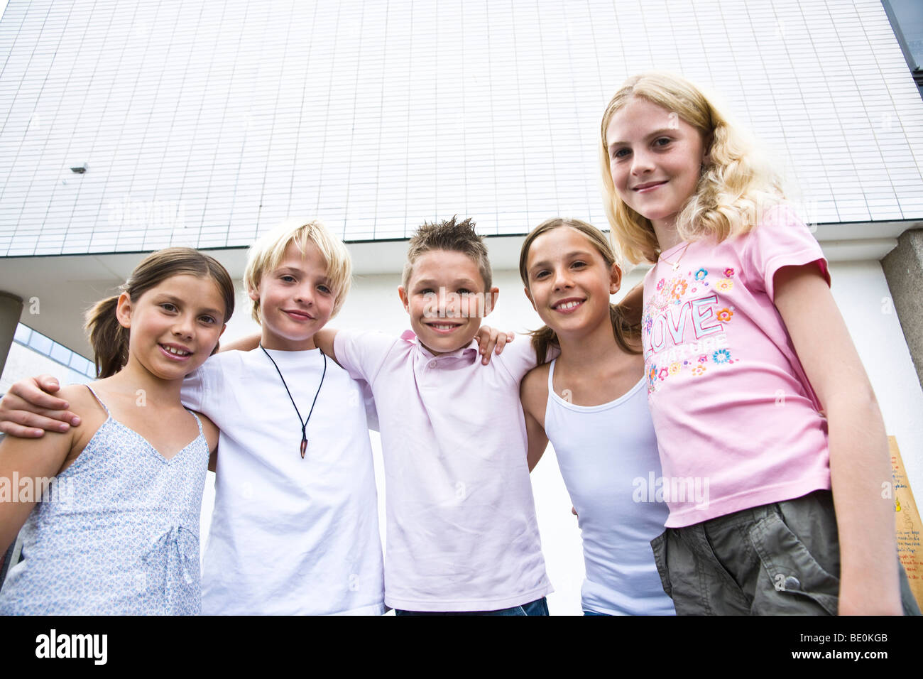 Five friends, cool, in the schoolyard Stock Photo - Alamy