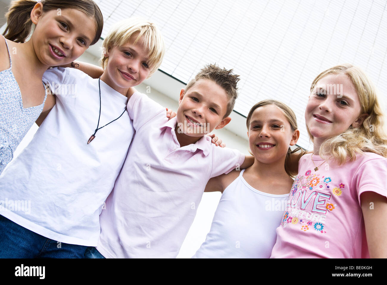 Five friends, cool, in the schoolyard Stock Photo - Alamy