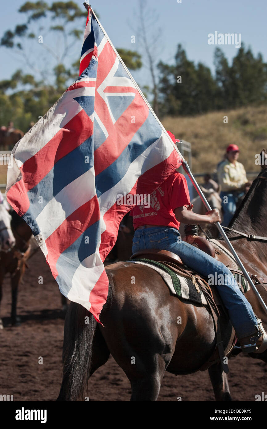 Female rodeo rider parades Hawaiian flag Stock Photo - Alamy
