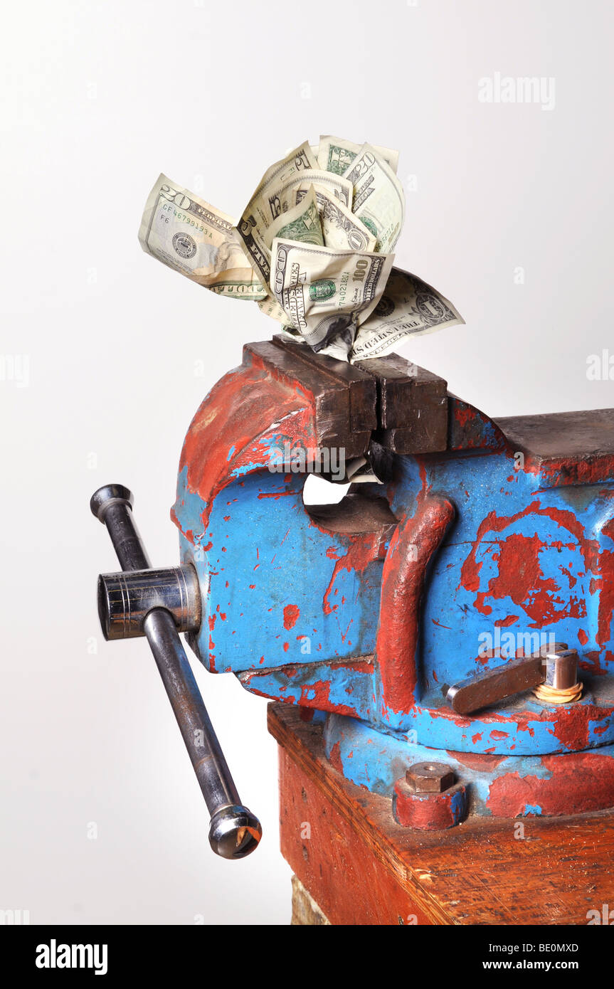 American dollars being crunched in a press Stock Photo - Alamy