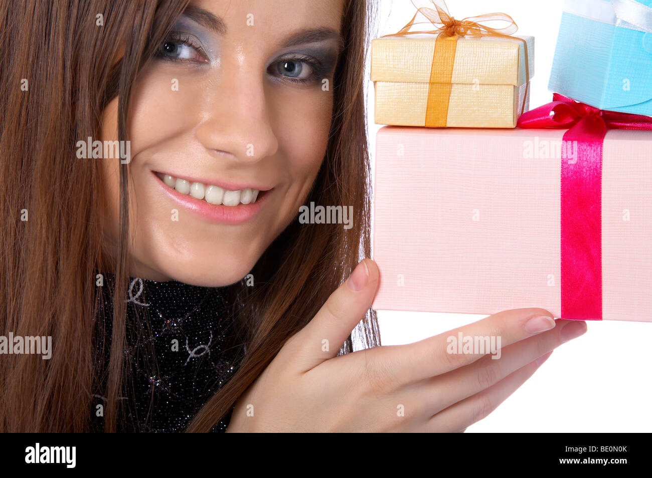 beautiful brunette model with gifts smiles Stock Photo - Alamy