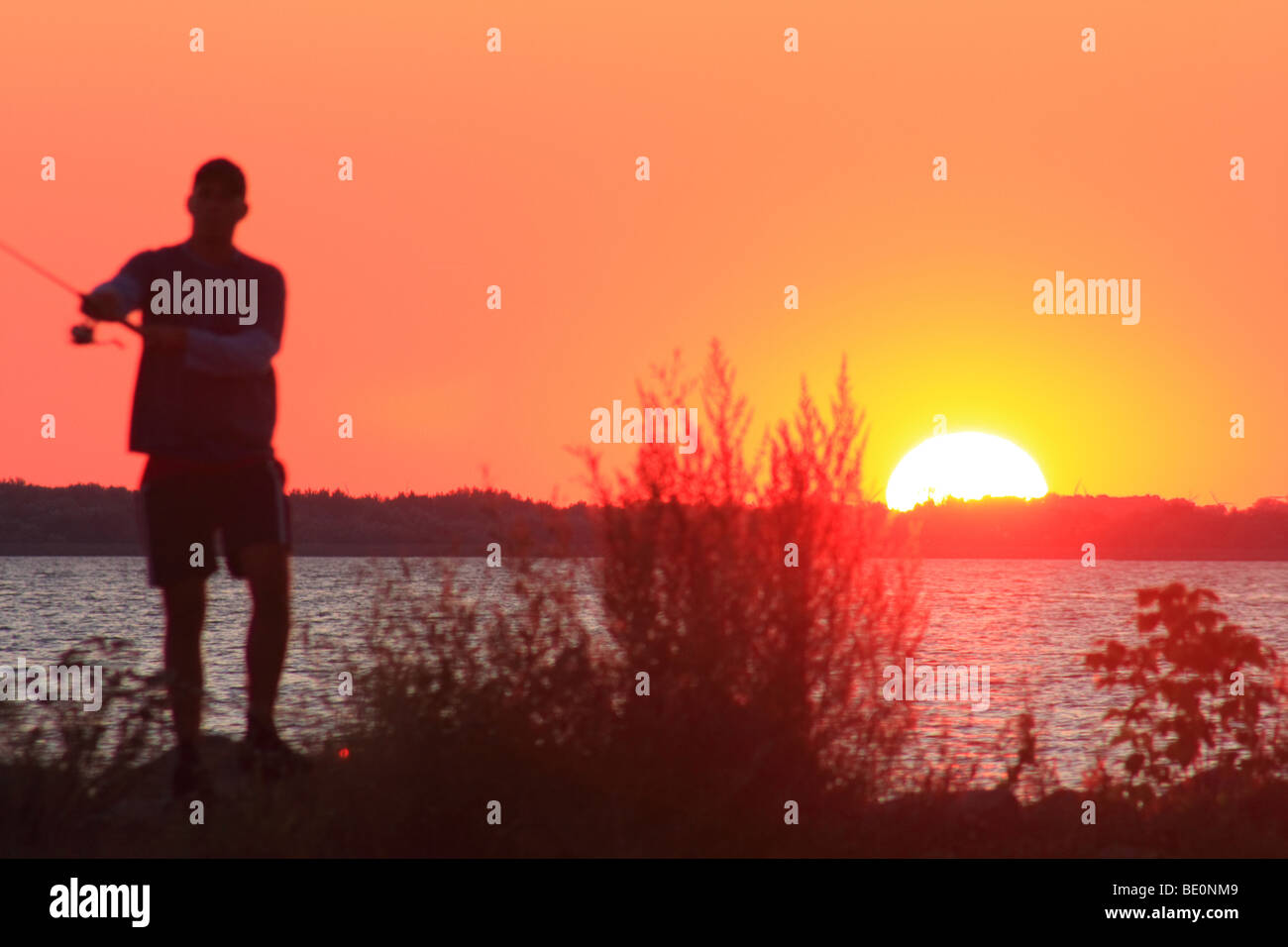 Fishing at the sunset on the Danube dam channel in Slovakia Stock Photo ...