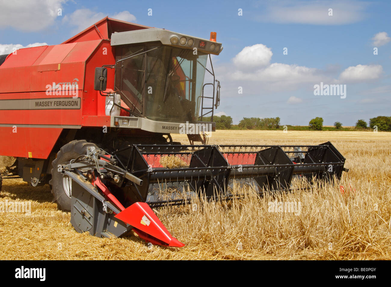 Combine harvester at work Stock Photo - Alamy