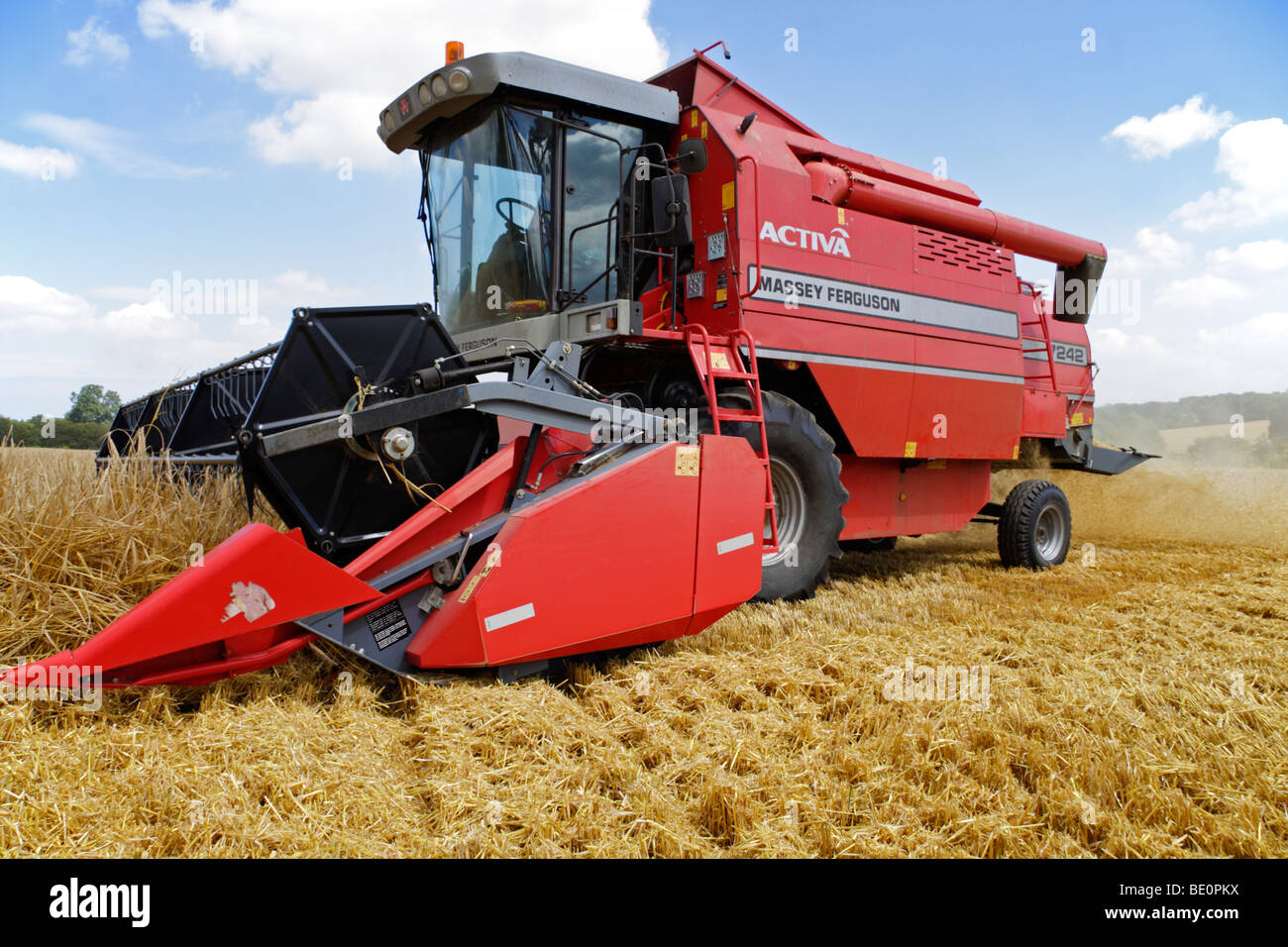 Combine harvester at work Stock Photo - Alamy