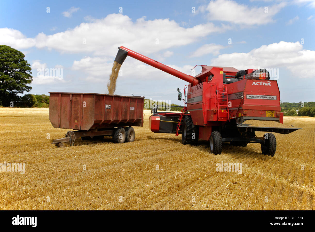 Combine harvester discharging grain hi-res stock photography and images ...
