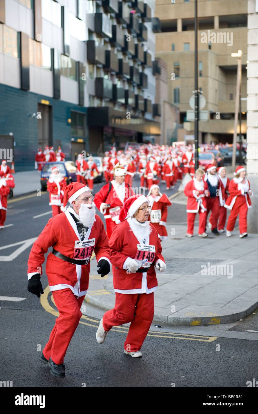 hundreds of santas on charity run in Red father Christmas outfits Stock ...