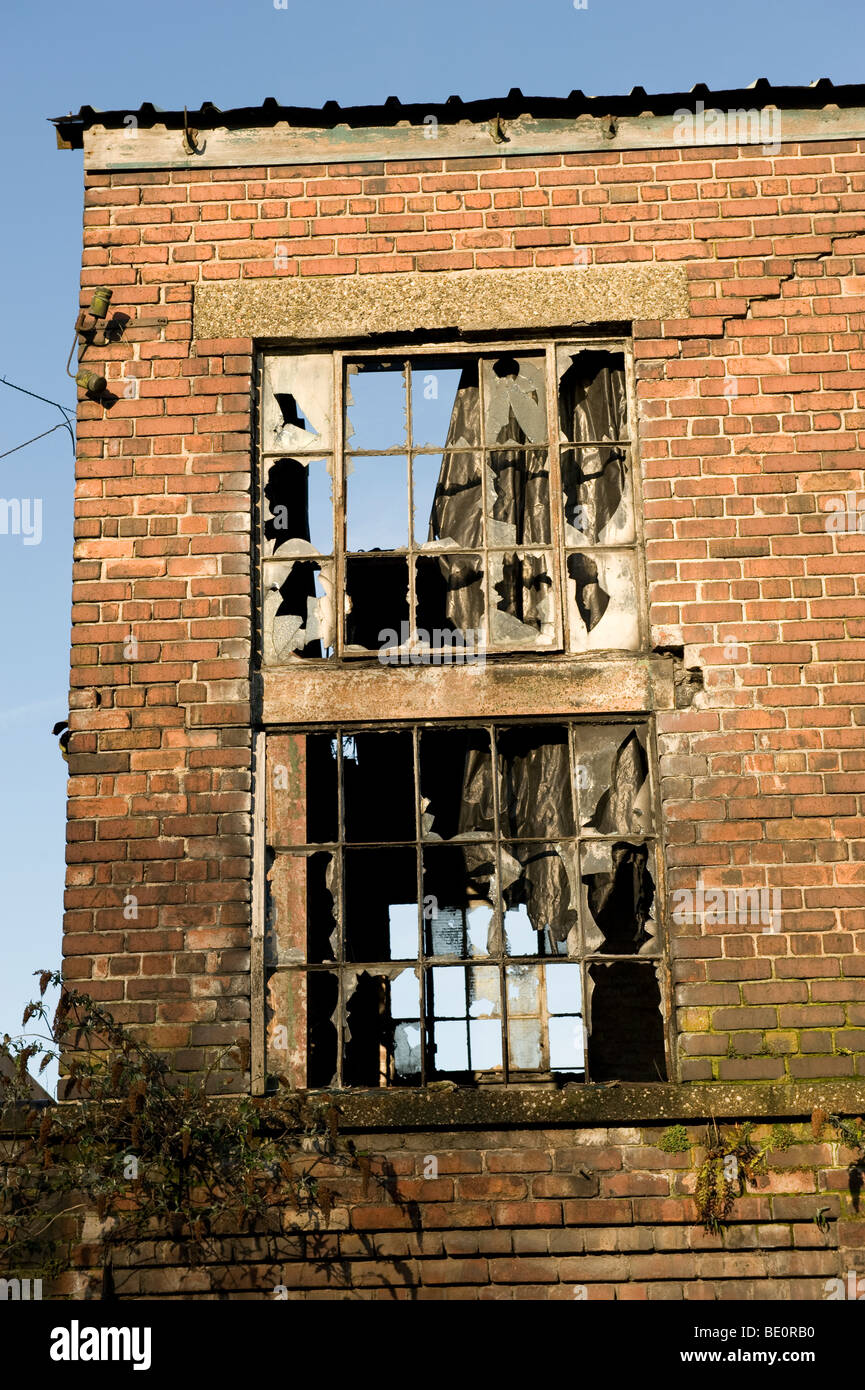 derelict and cracked broken building and decaying window Stock Photo ...