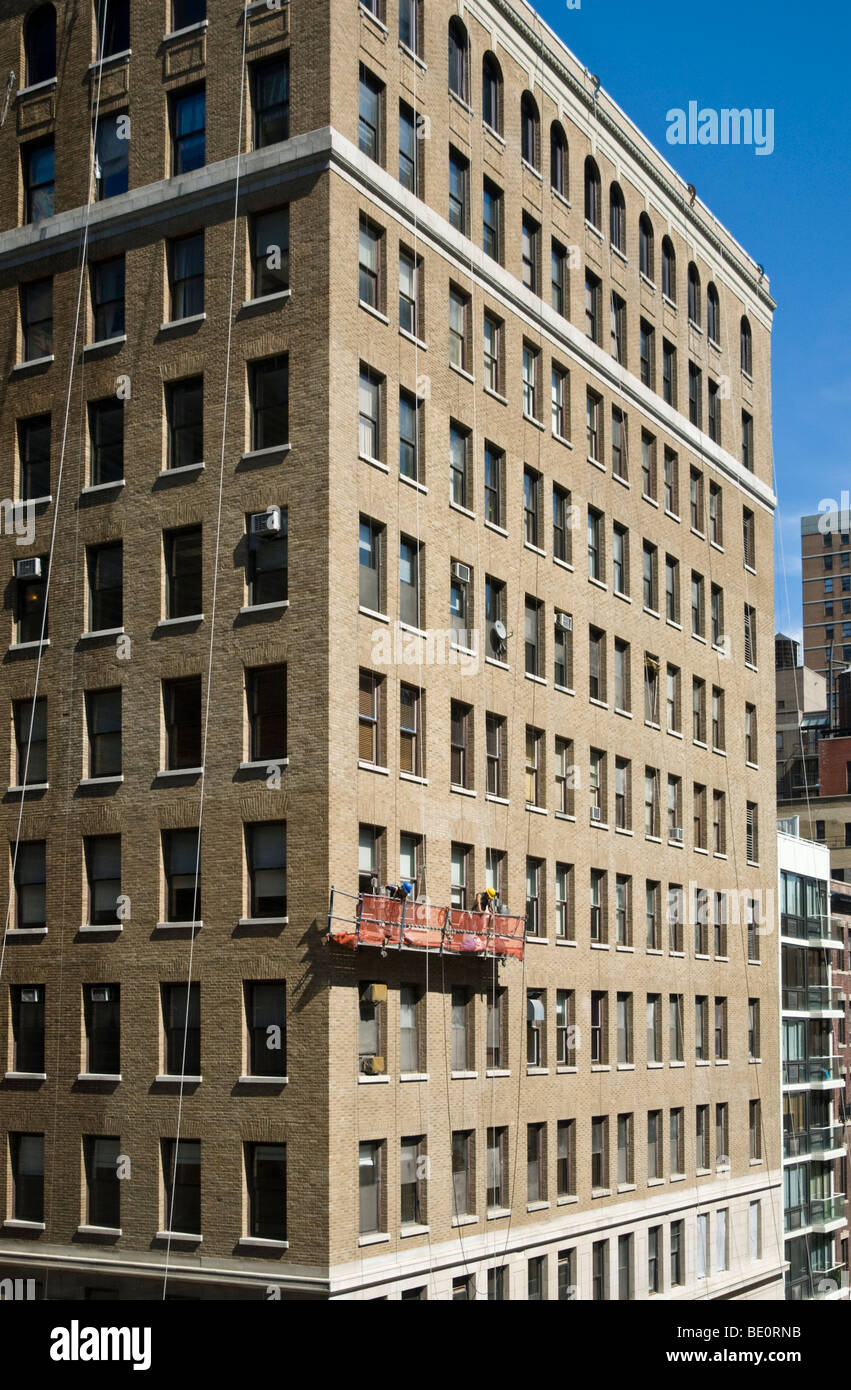 Window washers on a building in New York City Stock Photo - Alamy