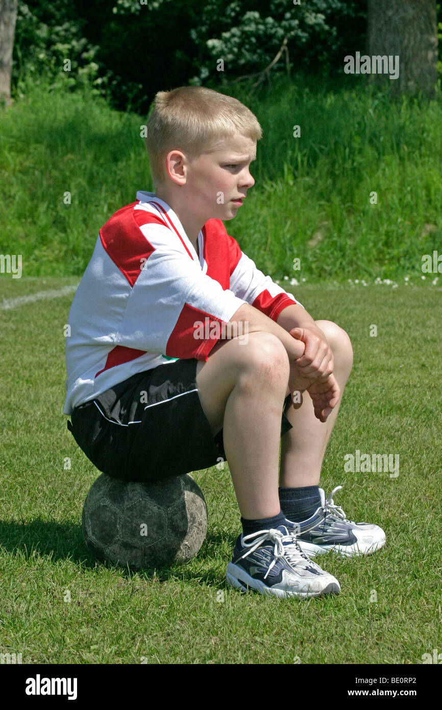Kids play football outside the ground hi-res stock photography and ...