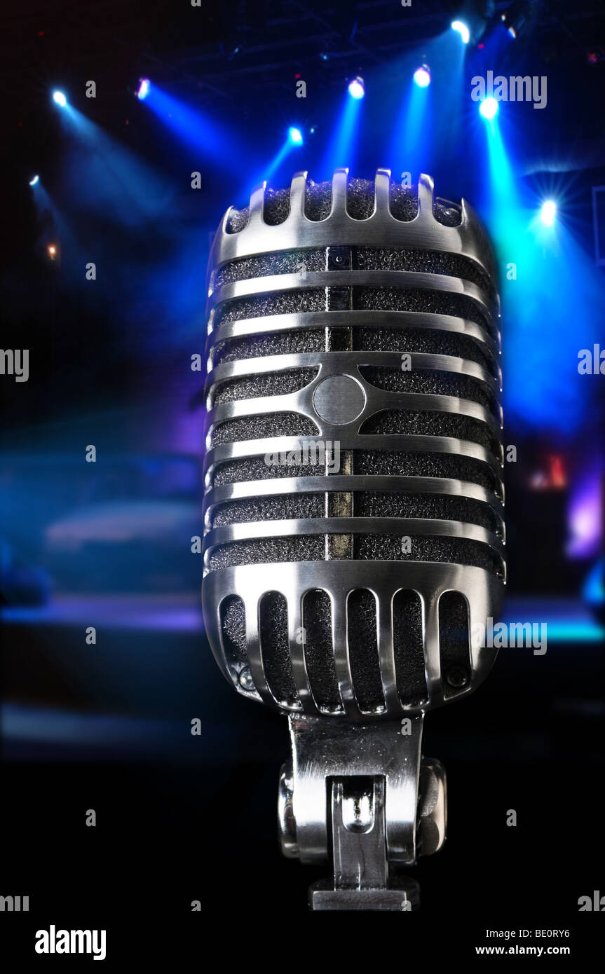 Vintage microphone in close-up view over a stage background Stock Photo ...
