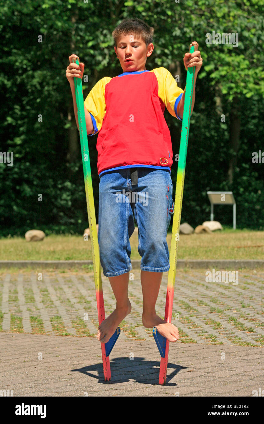 Boy on stilts hi-res stock photography and images - Alamy