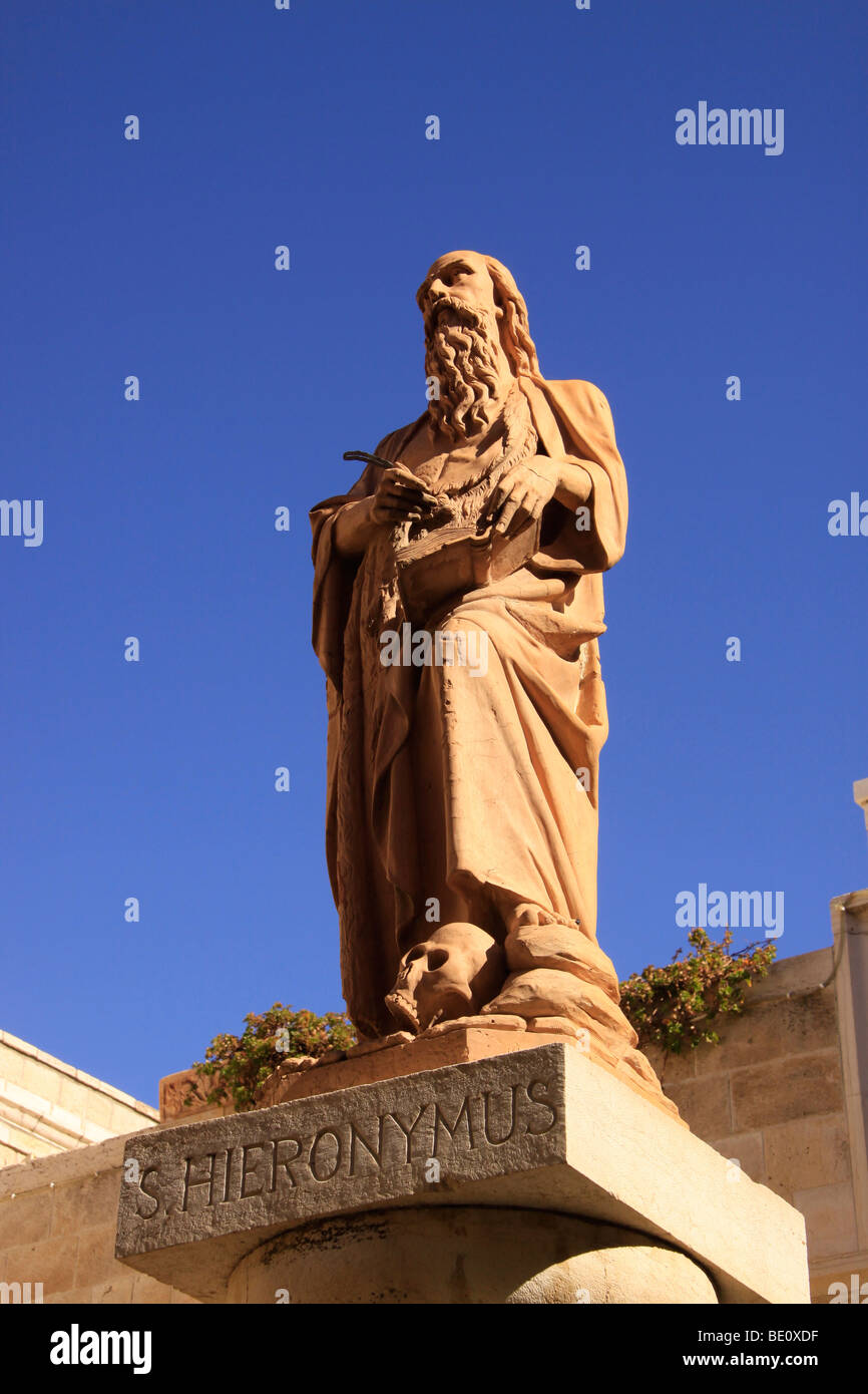 Bethlehem, statue of St. Jerome in front of the Church of St. Catherine ...