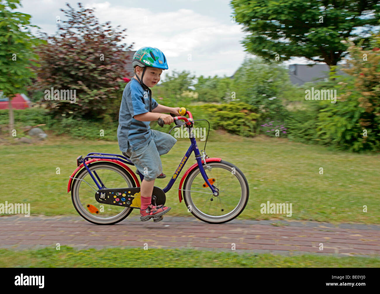young boy cycling Stock Photo - Alamy