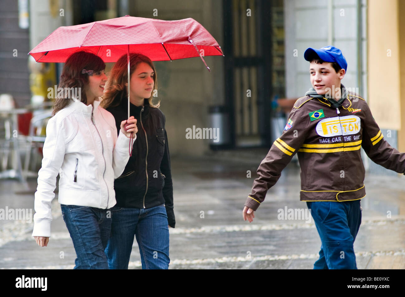 Young people, rain Stock Photo - Alamy