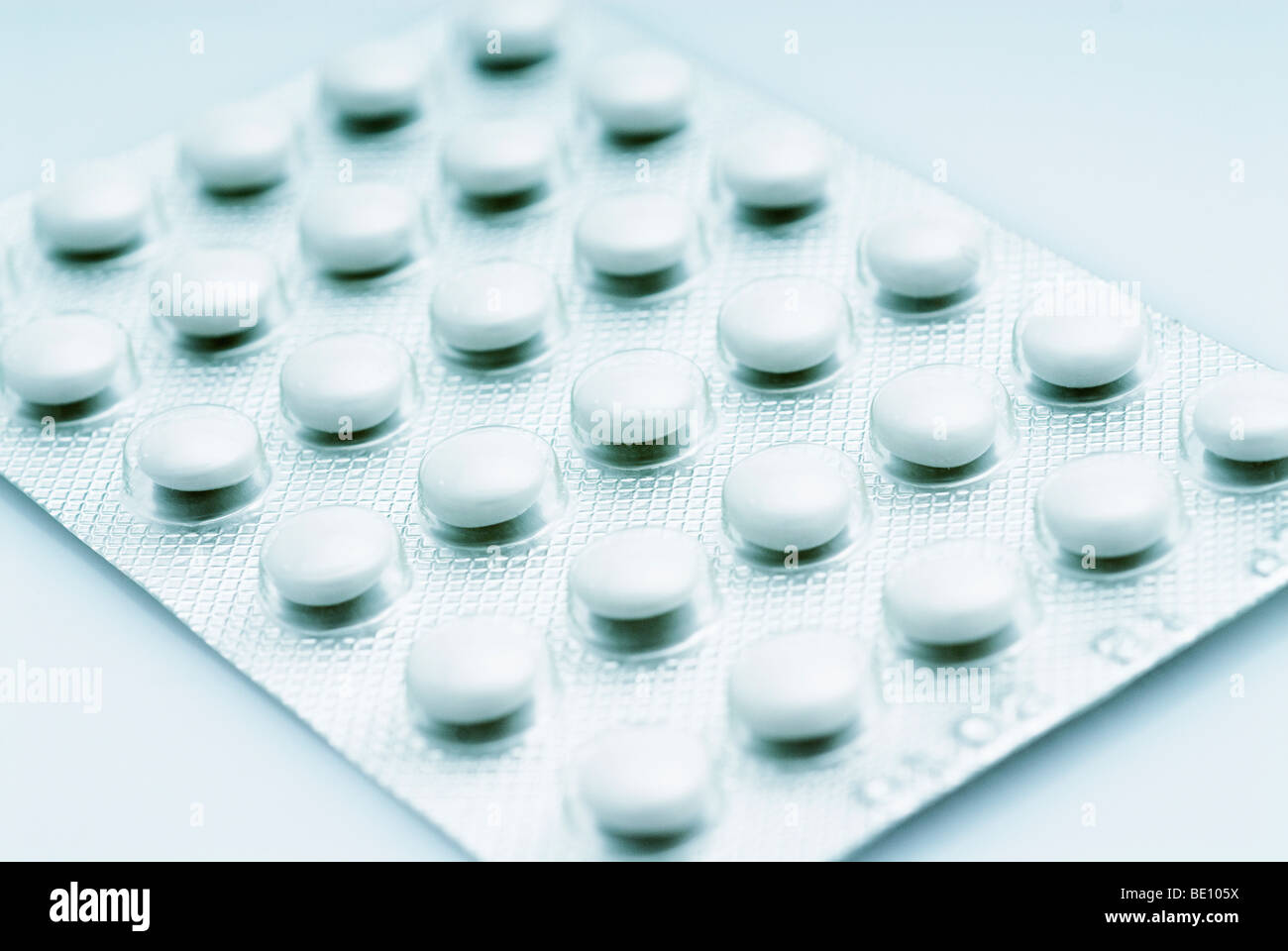 white coated tablets in blister packaging Stock Photo - Alamy